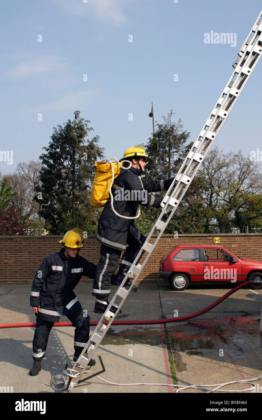 Fireman Climbing A Ladder High Resolution Stock Photography and Images ...