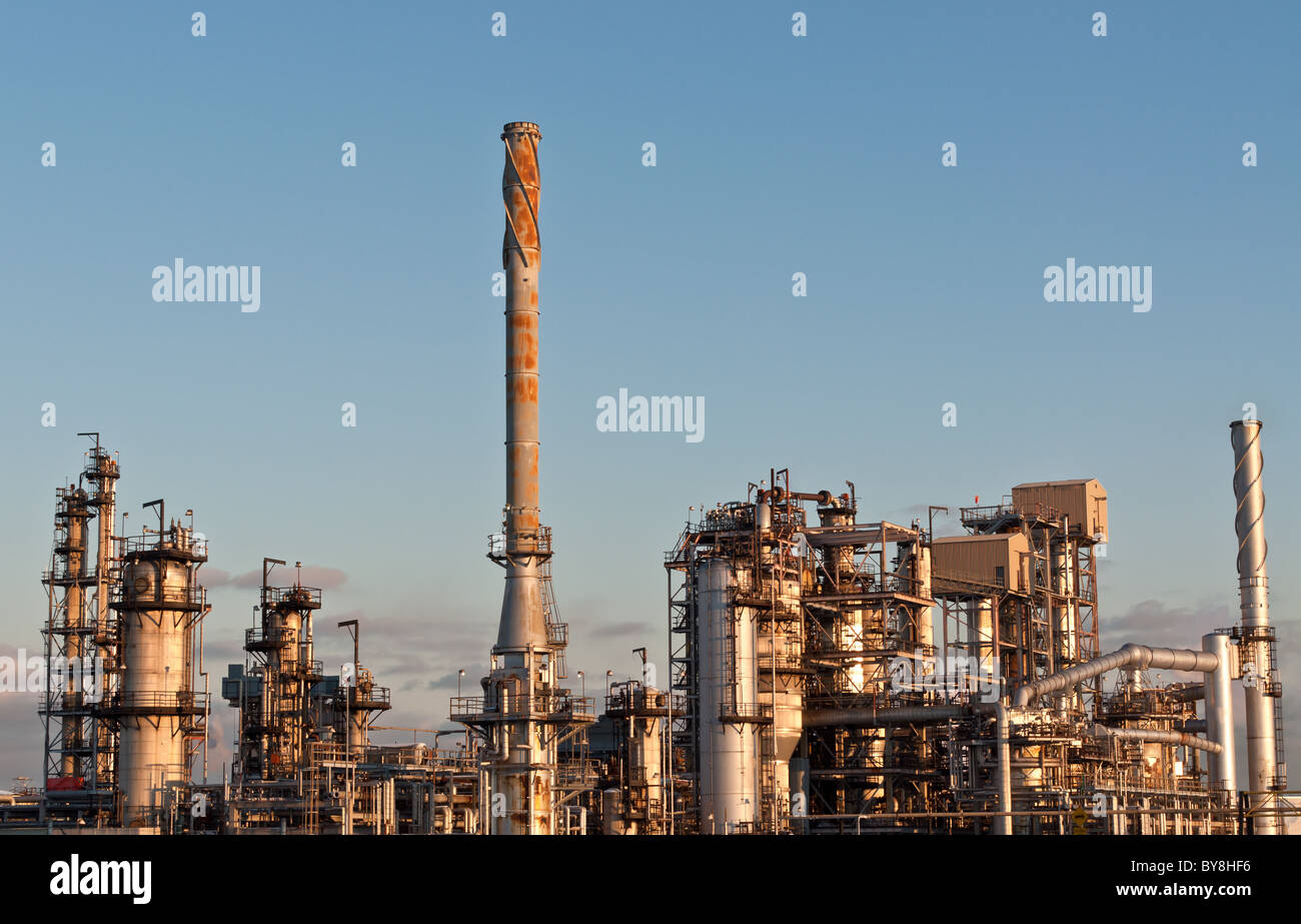 A petrochemical refinery plant with pipes and cooling towers Stock ...