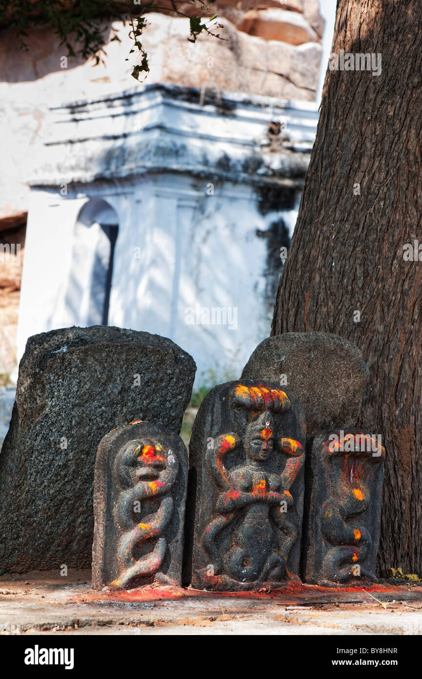 Hindu altar stones at a village temple depicting Indian vishnu deity in ...