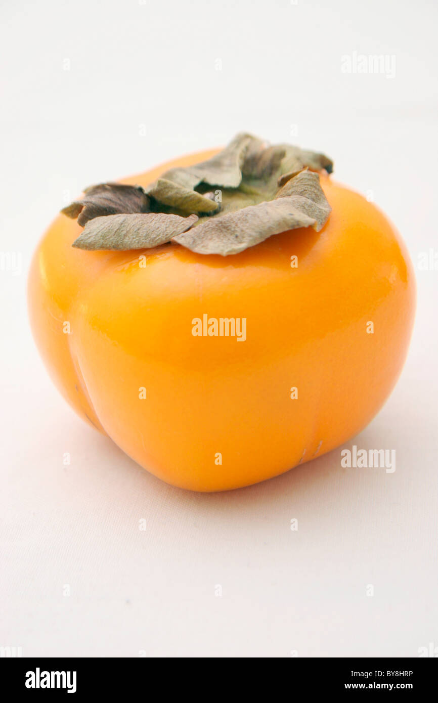 Sharon fruit on white background Stock Photo - Alamy