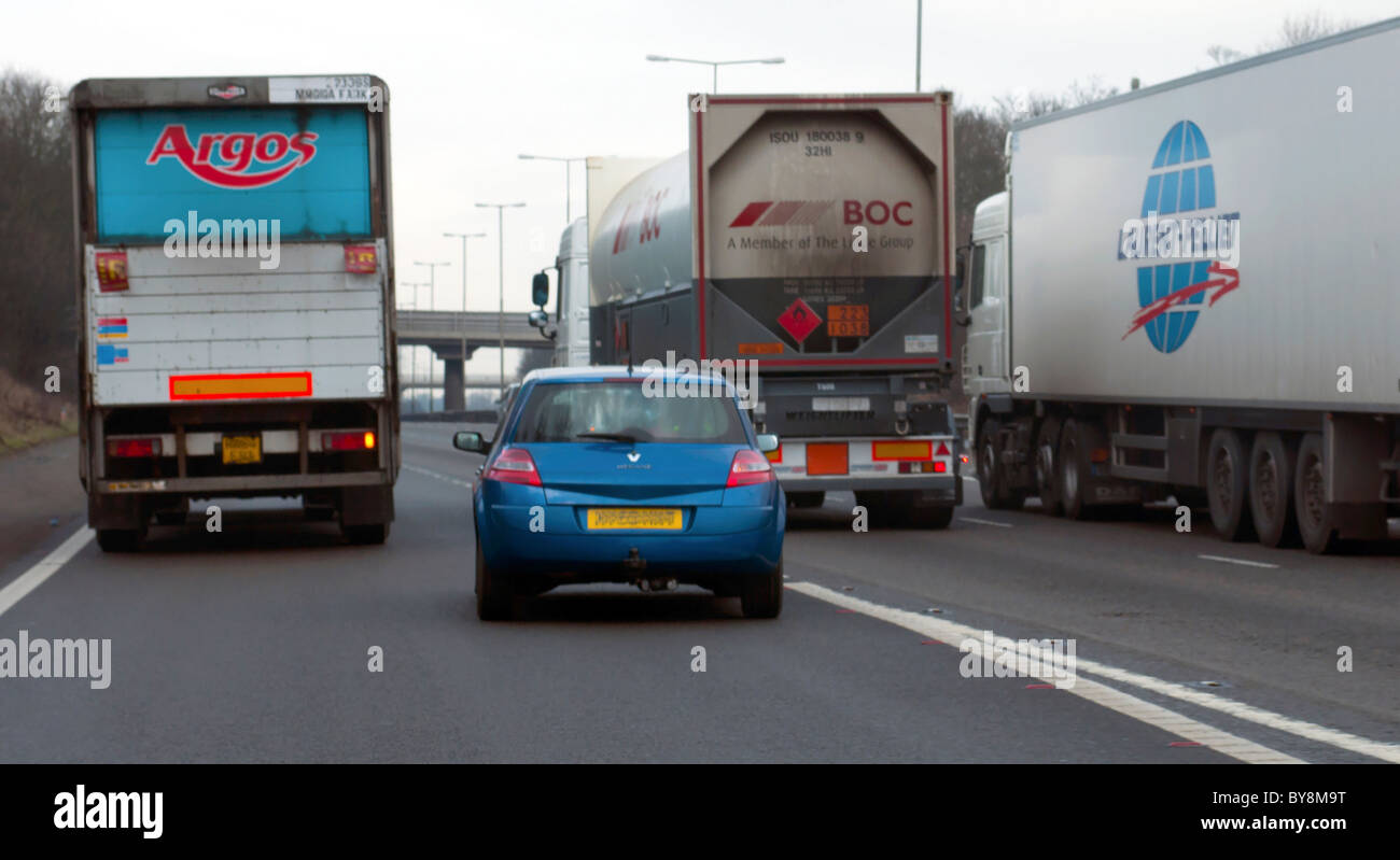 Aggressive and Dangerous Car Driver Driving into Merging Motorway Lane ...
