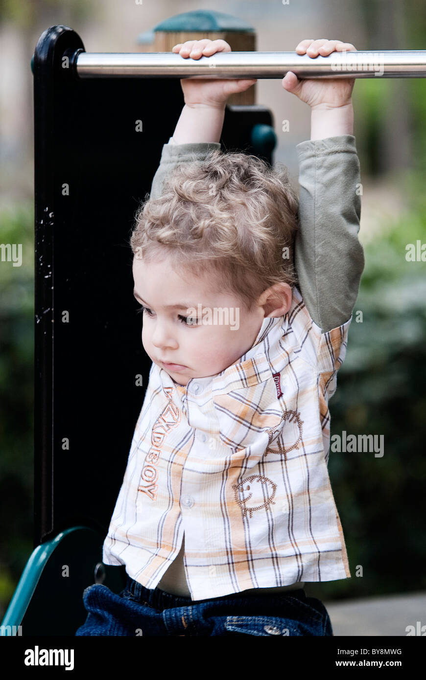 Preschool boy before a slide, running Stock Photo - Alamy