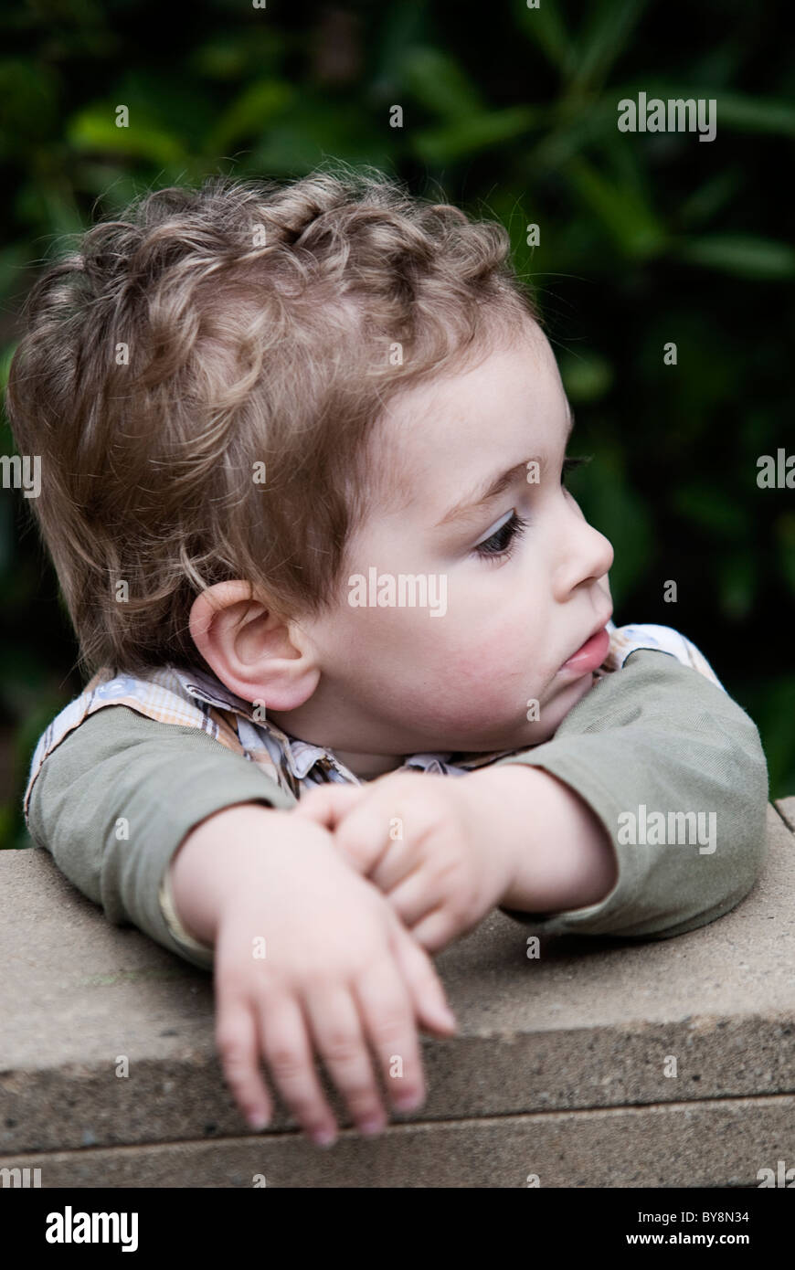 the child is standing pensively Stock Photo - Alamy
