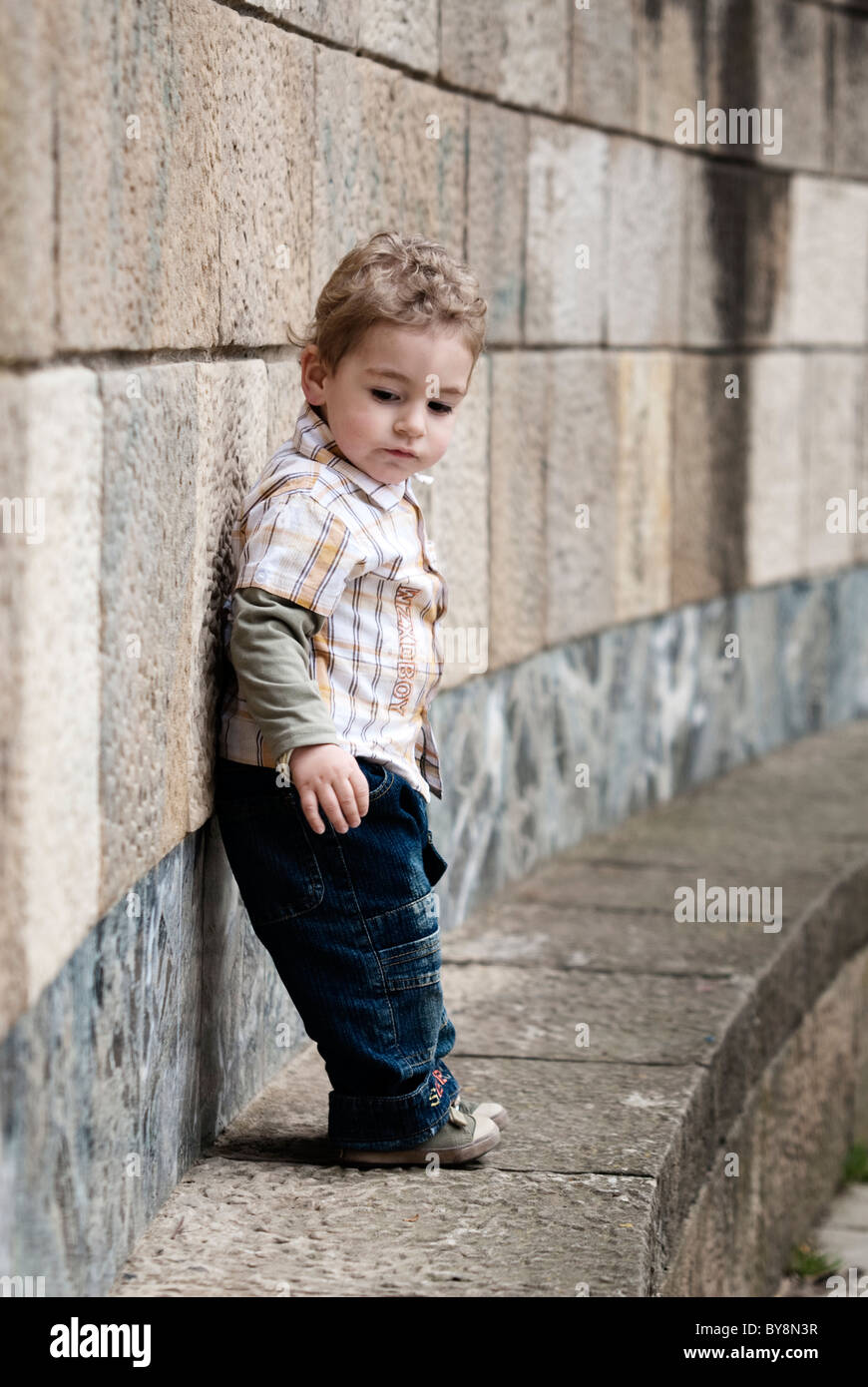 the child is standing pensively Stock Photo - Alamy