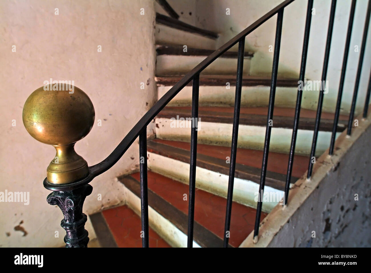 Wrought iron handrail of an old staircase Stock Photo - Alamy