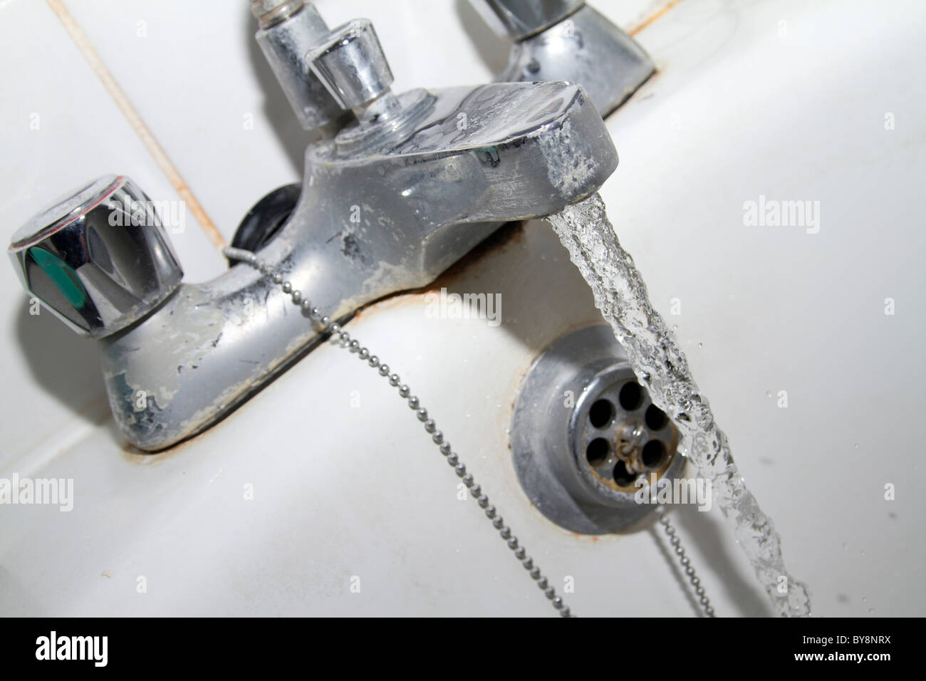 UK. TAP IN A BATHROOM IN A COUNCIL FLAT Stock Photo - Alamy