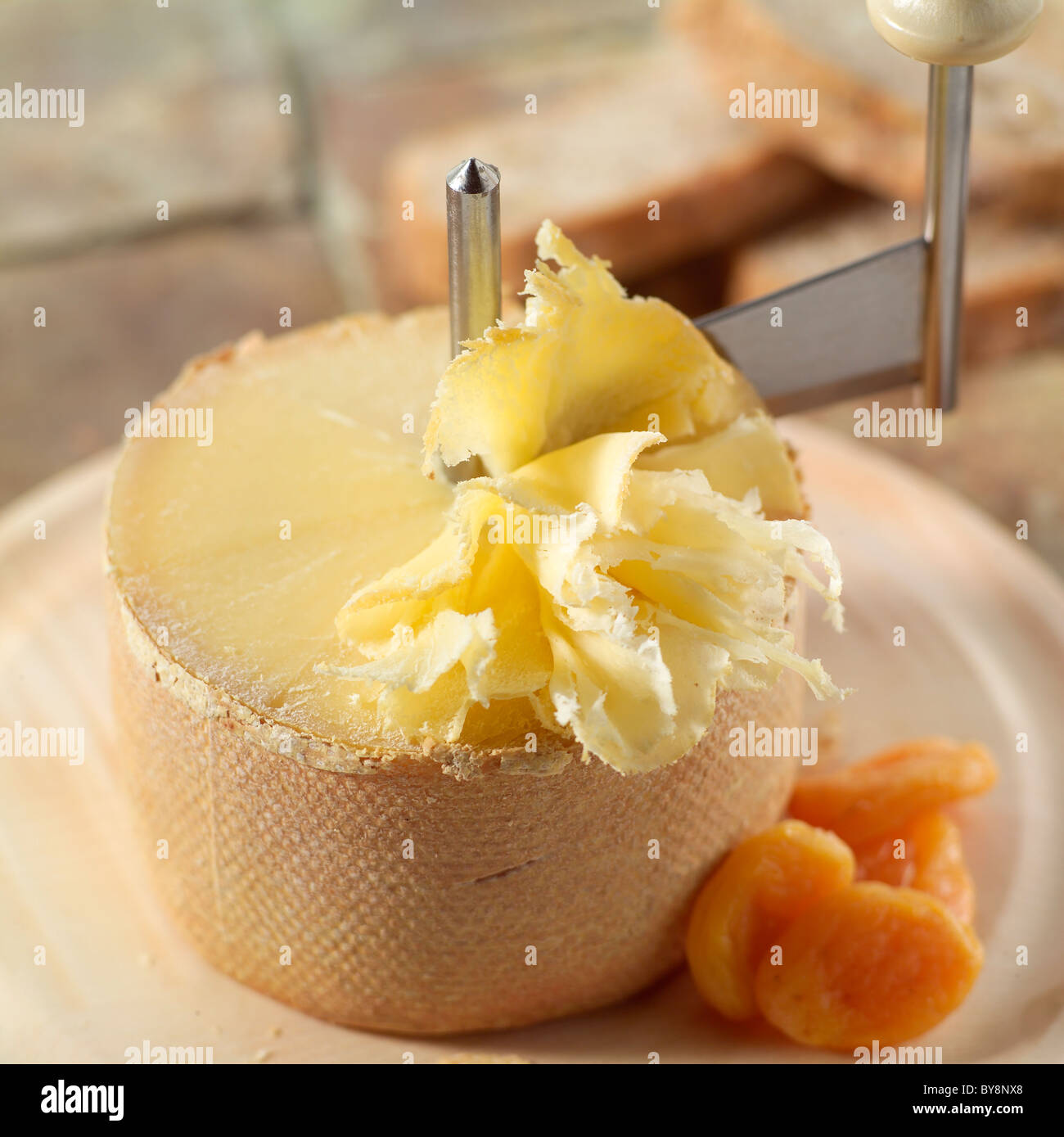 Cheese Wheel with Cheese Flakes Stock Photo - Alamy