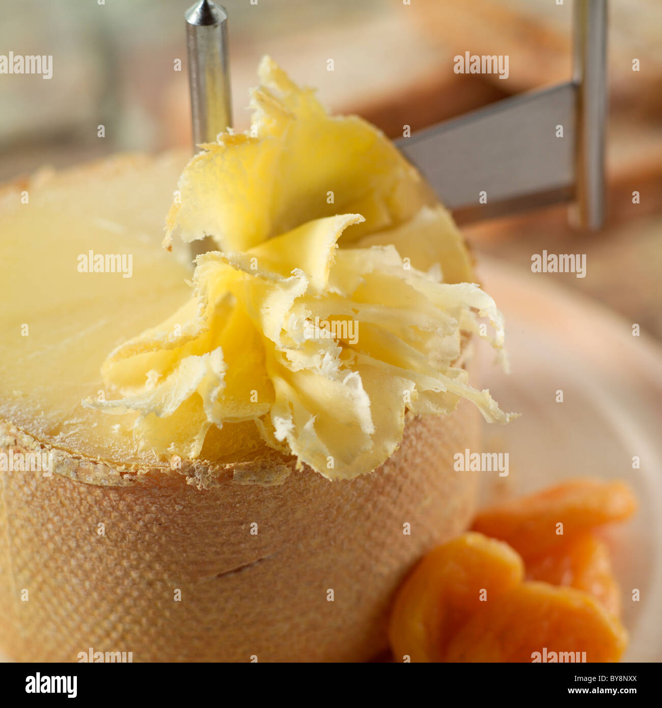 Cheese Wheel and Cheese Flakes Stock Photo - Alamy