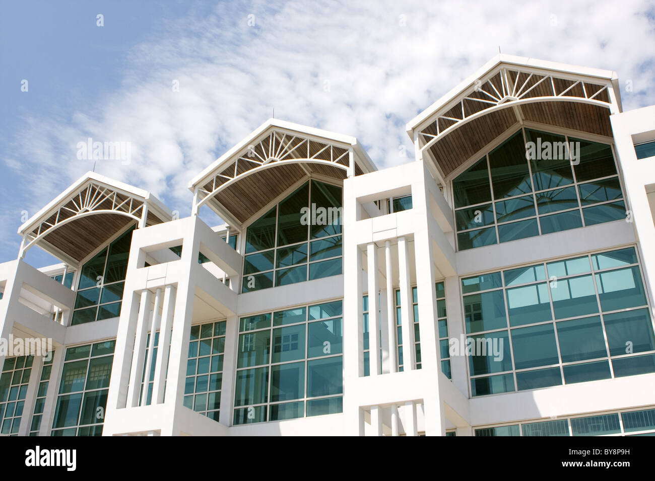 The modern architectural design of a steel and glass building facade ...