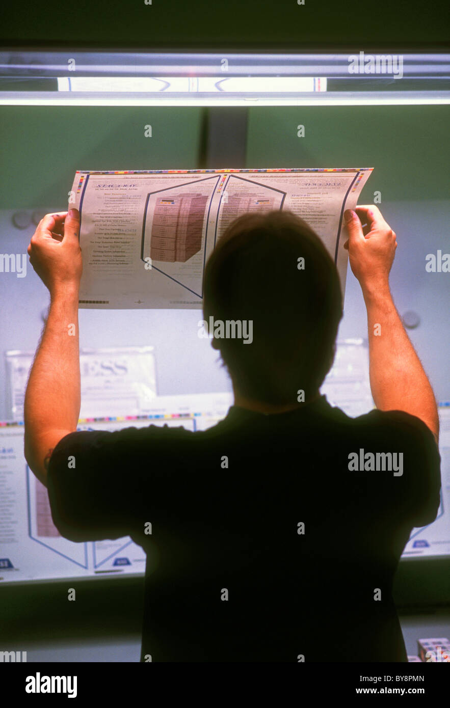 Man checking printing proofs Stock Photo - Alamy