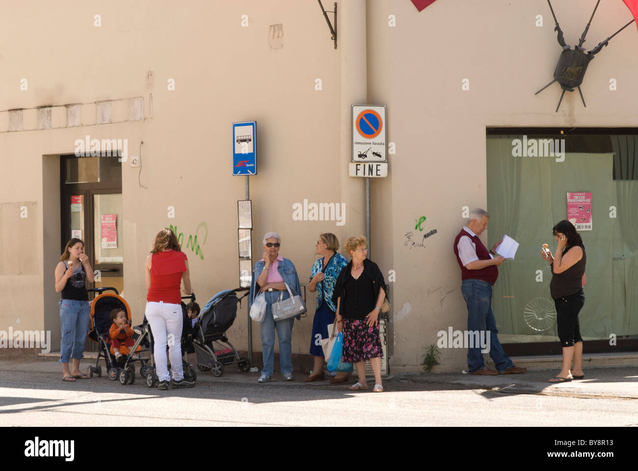 italian people waiting at a bus stop in Foligno Stock Photo - Alamy
