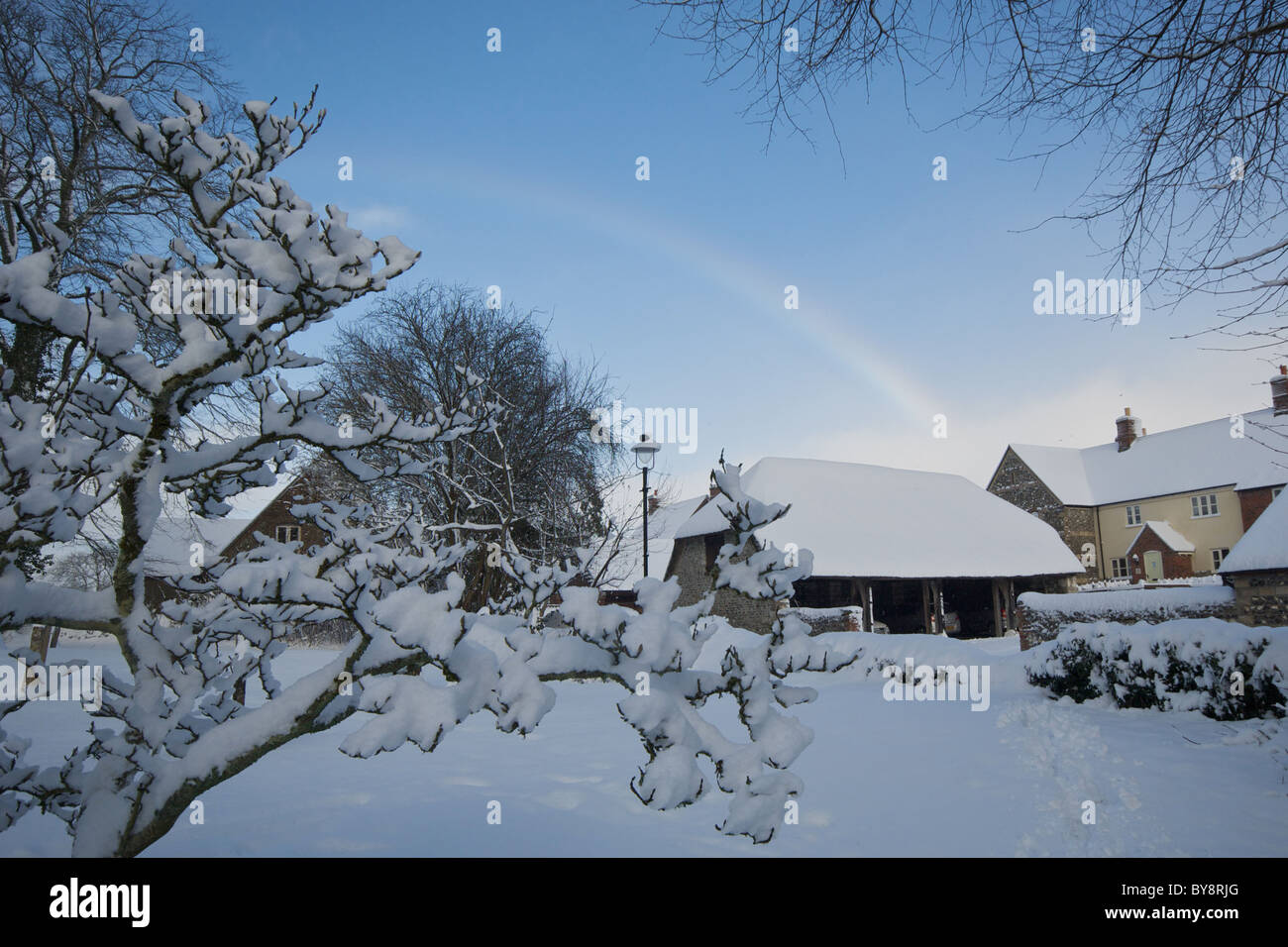 A snowbow over a snowy scene in Maiden Newton, Dorset Stock Photo - Alamy