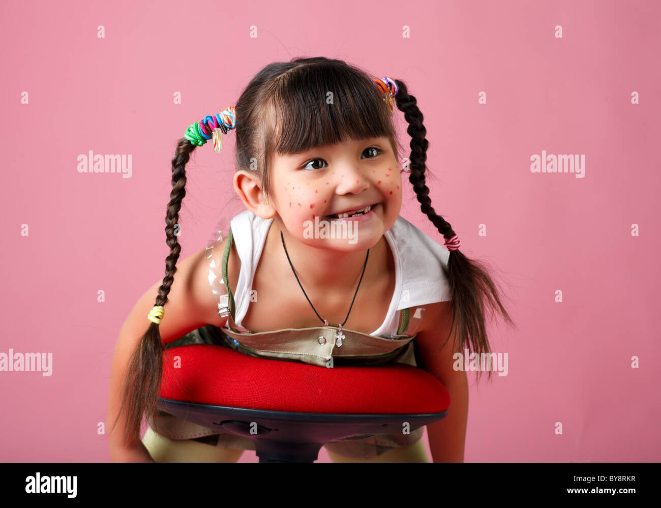 Little fashion model posin in studio Stock Photo - Alamy