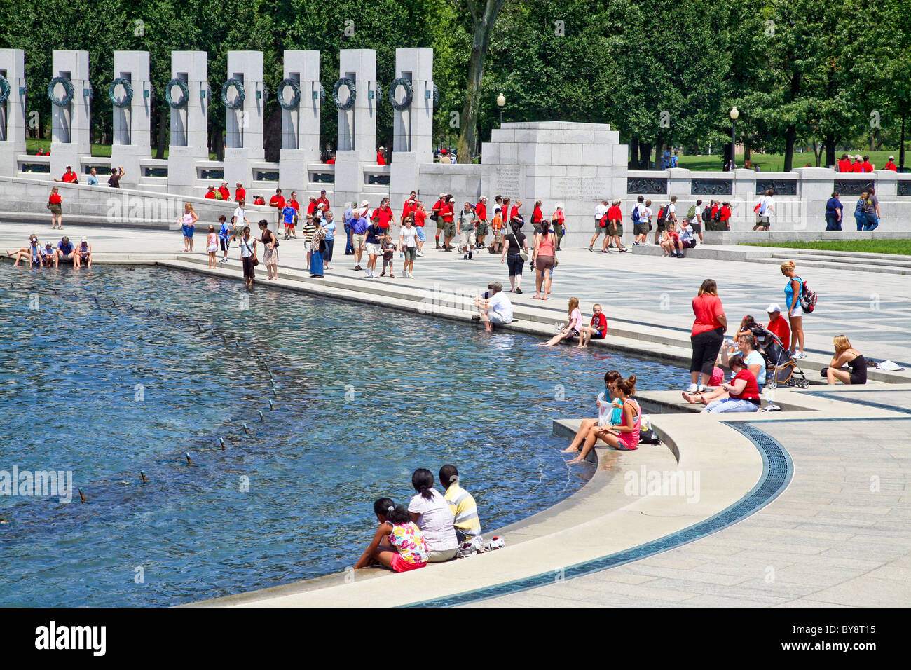 Visitors are cooling their feet in the pool at the World War II ...