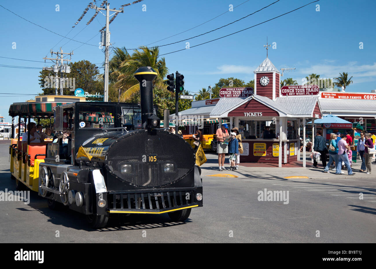 The Conch Tour Train passes the ticket office at the junction of Front ...