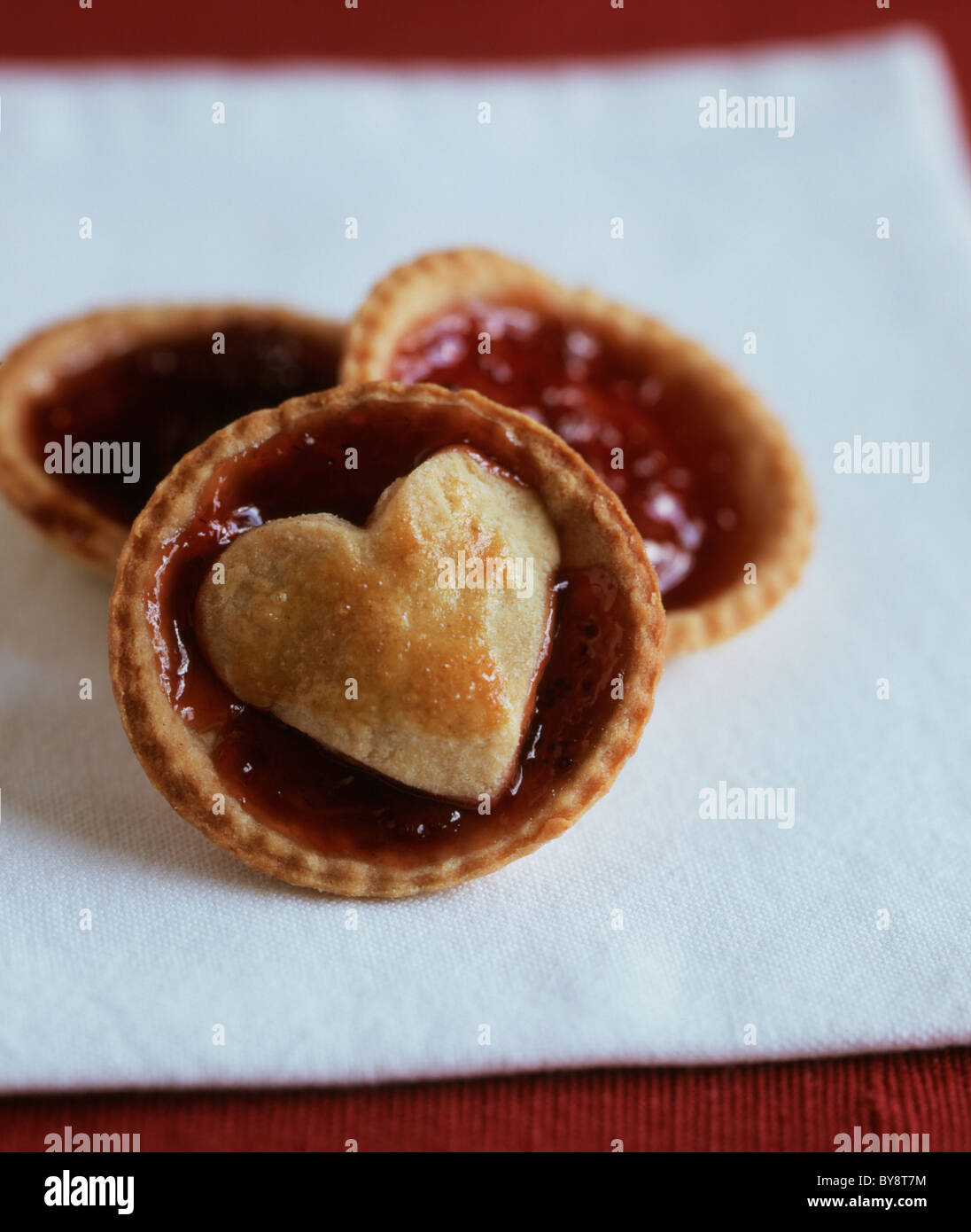 Jam Tart with Heart Shaped Pastry lid Stock Photo - Alamy