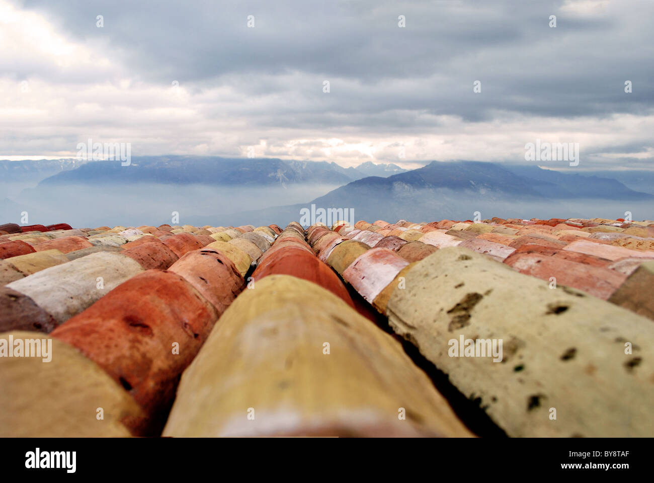 terra cotta tiled roof with background views of the mountains Stock ...