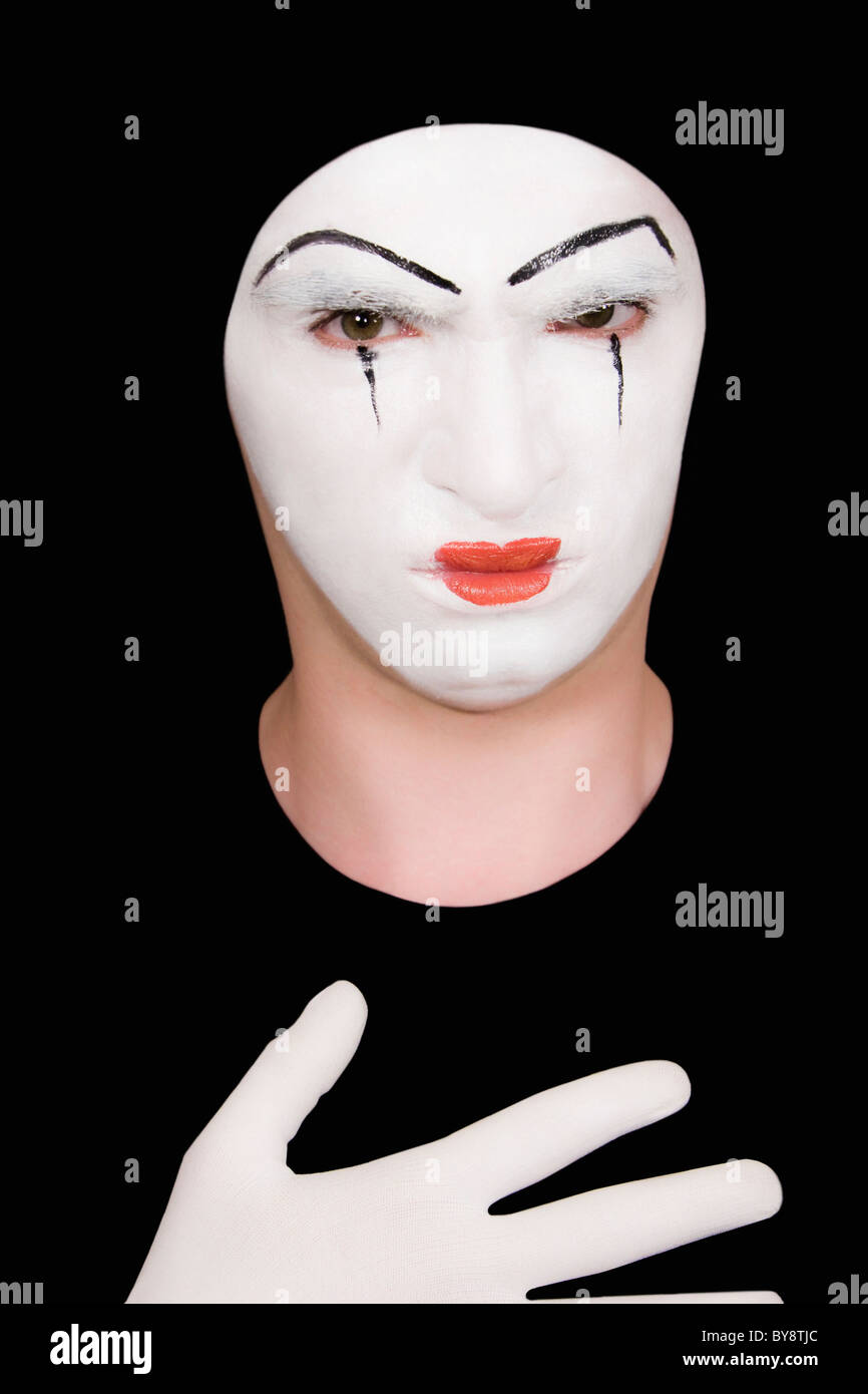 Portrait of malicious mime on black background Stock Photo - Alamy