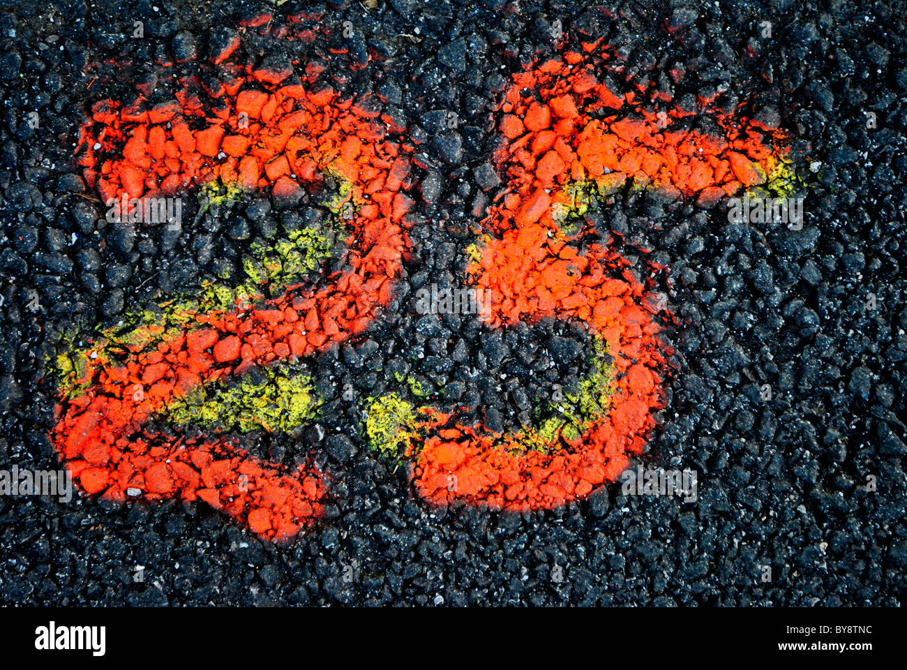red number 25 written on asphalt Stock Photo - Alamy