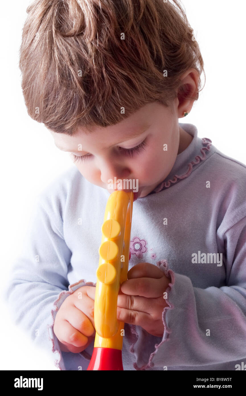 baby playing a toy trumpet Stock Photo - Alamy