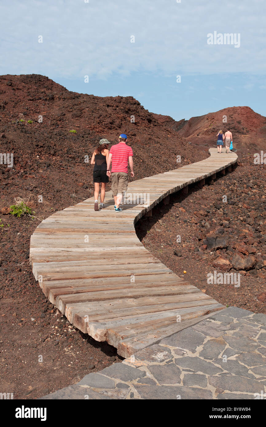 Walking on a Wooden pathway through a volcanic landscape near Punto ...