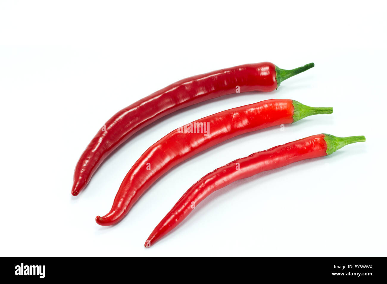 Red hot chili peppers on white background Stock Photo - Alamy