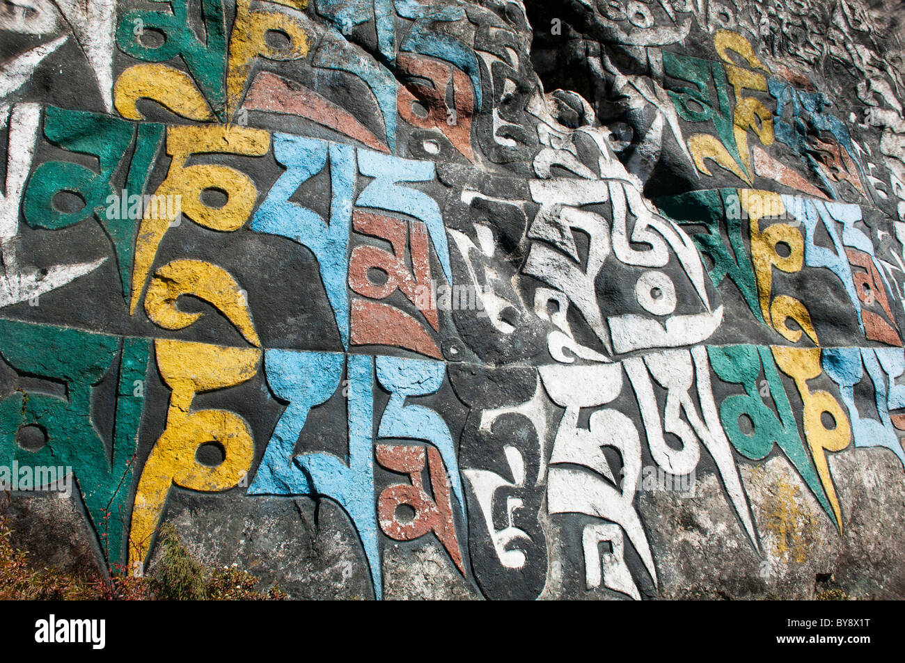 Tibetan Sanskrit on mani wall in the Everest Region of Nepal Stock ...