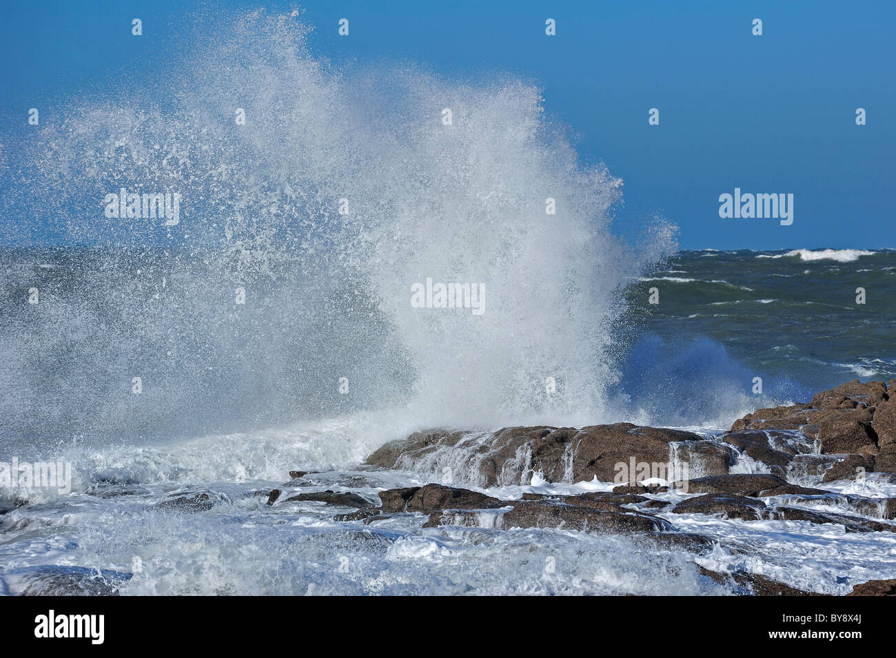 Waves crashing onto rocks along the Normandy coast, France Stock Photo ...