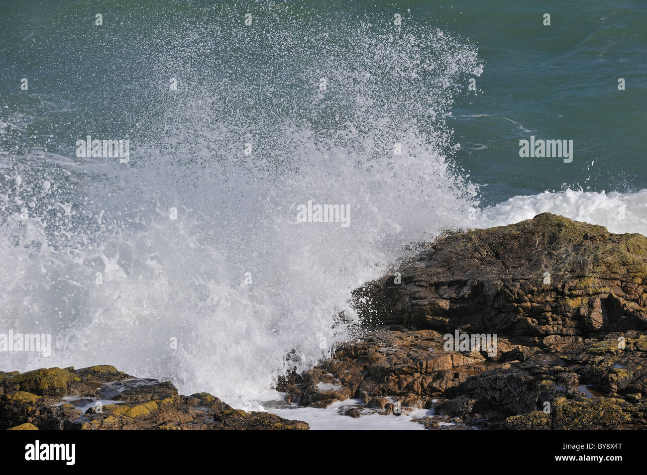 Waves crashing onto rocks along the Normandy coast, France Stock Photo ...
