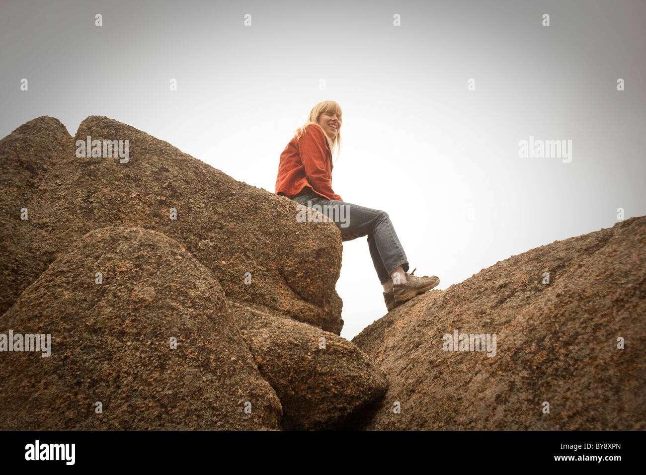 girl sits on rock above Stock Photo - Alamy