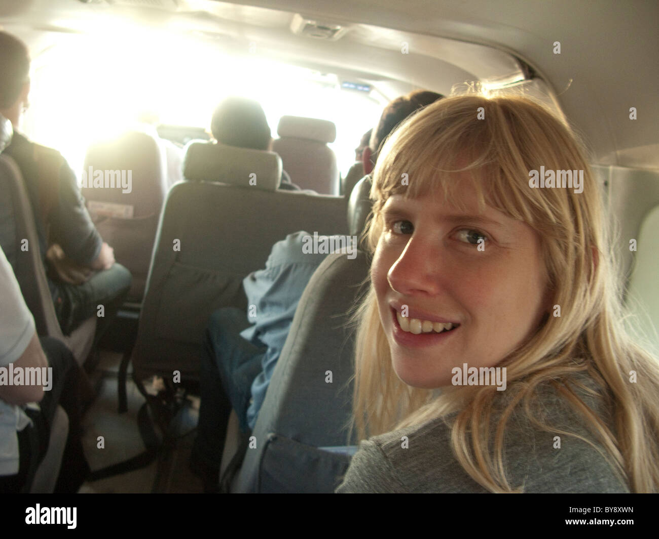 girl on small plane smiles Stock Photo - Alamy