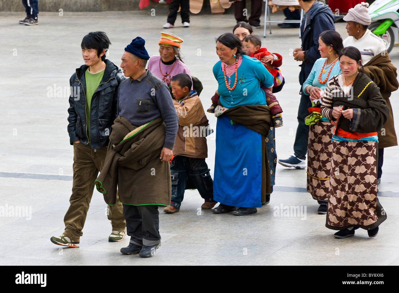 Tibetan family walking in Barkhor Square Lhasa Tibet. JMH4445 Stock ...