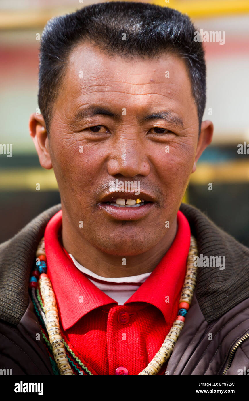 Tibetan man in red shirt in Barkhor Square, Lhasa, Tibet. JMH4457 Stock ...