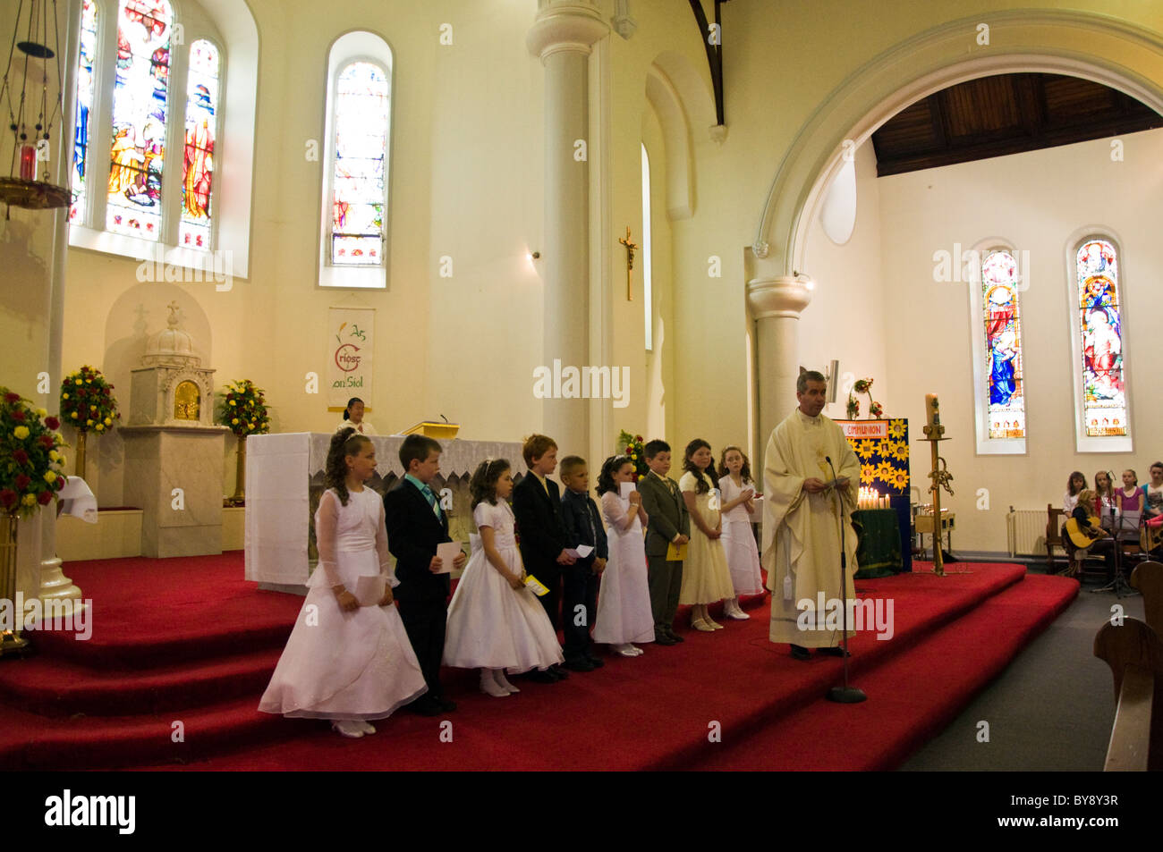 Child taking communion hi-res stock photography and images - Alamy