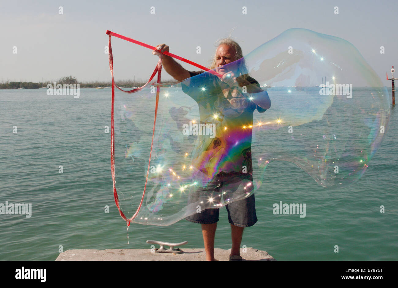 Man making big bubble Stock Photo - Alamy