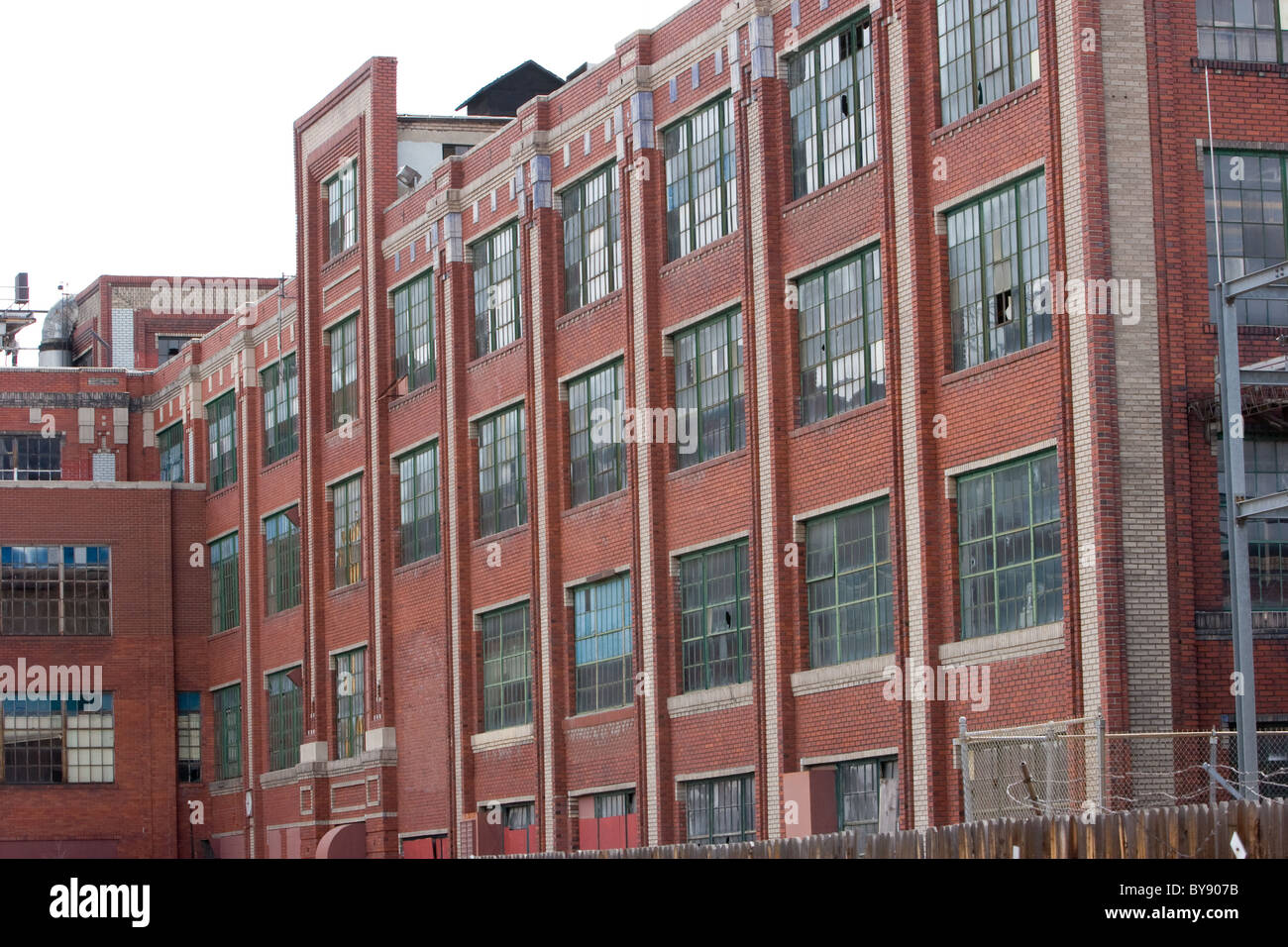 Abandoned old manufacturing plant - broken windows and boarded up Stock ...