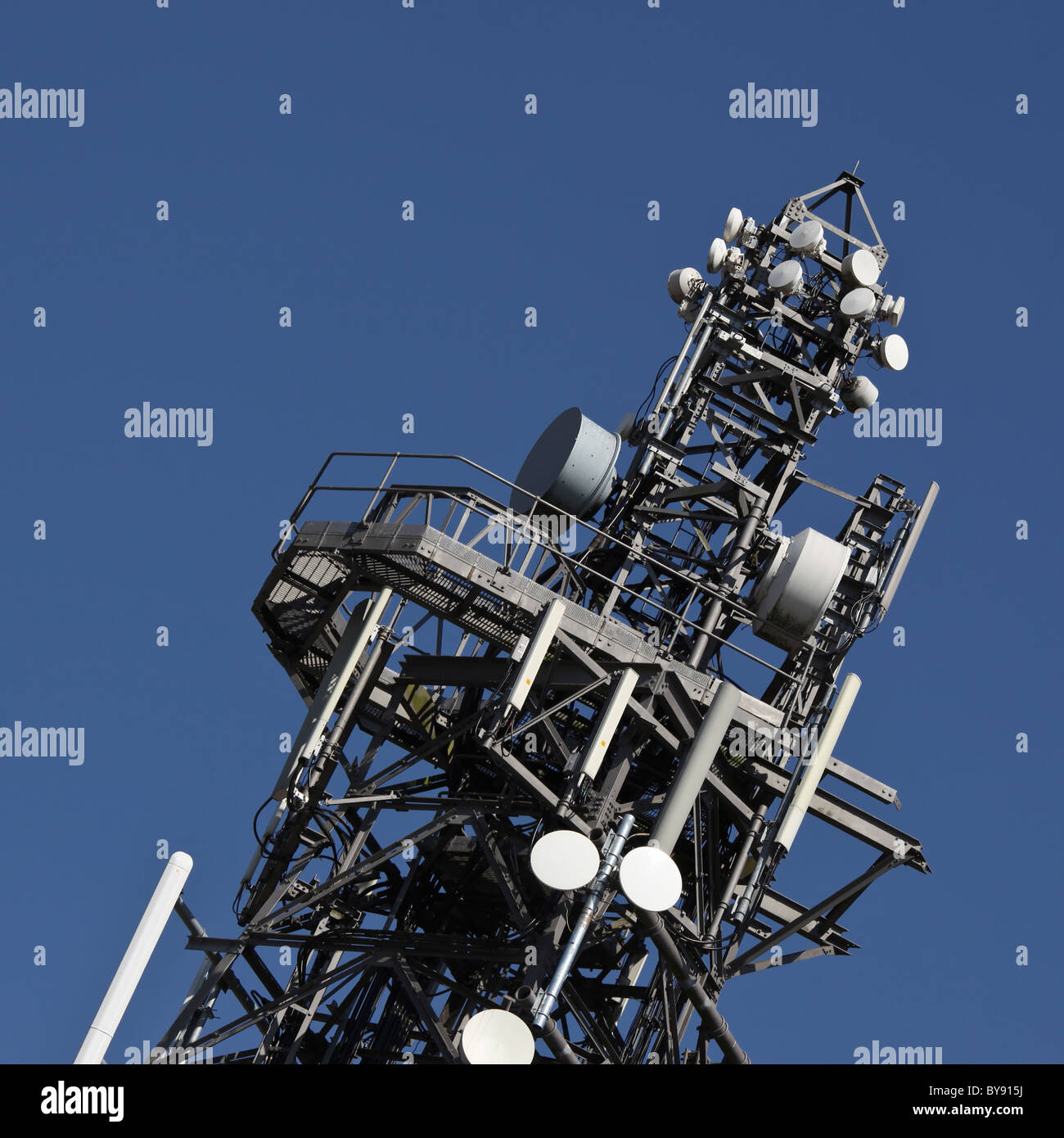 A telecommunication tower with microwave dishes and cell phone antennas Stock Photo - Alamy