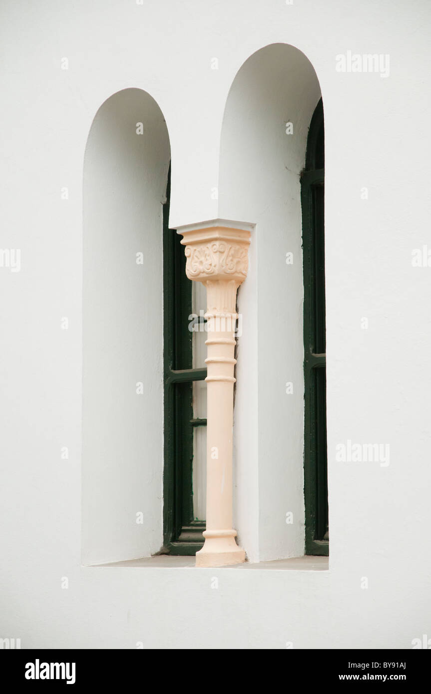 Column window on white plaster wall at the museum of history in Tetouan ...