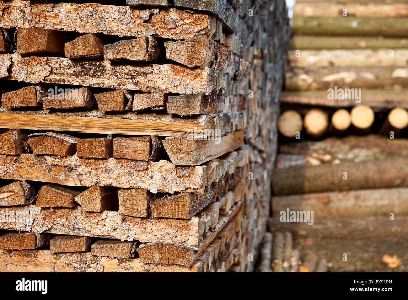 Piles of roughly cut and stacked wood Stock Photo - Alamy