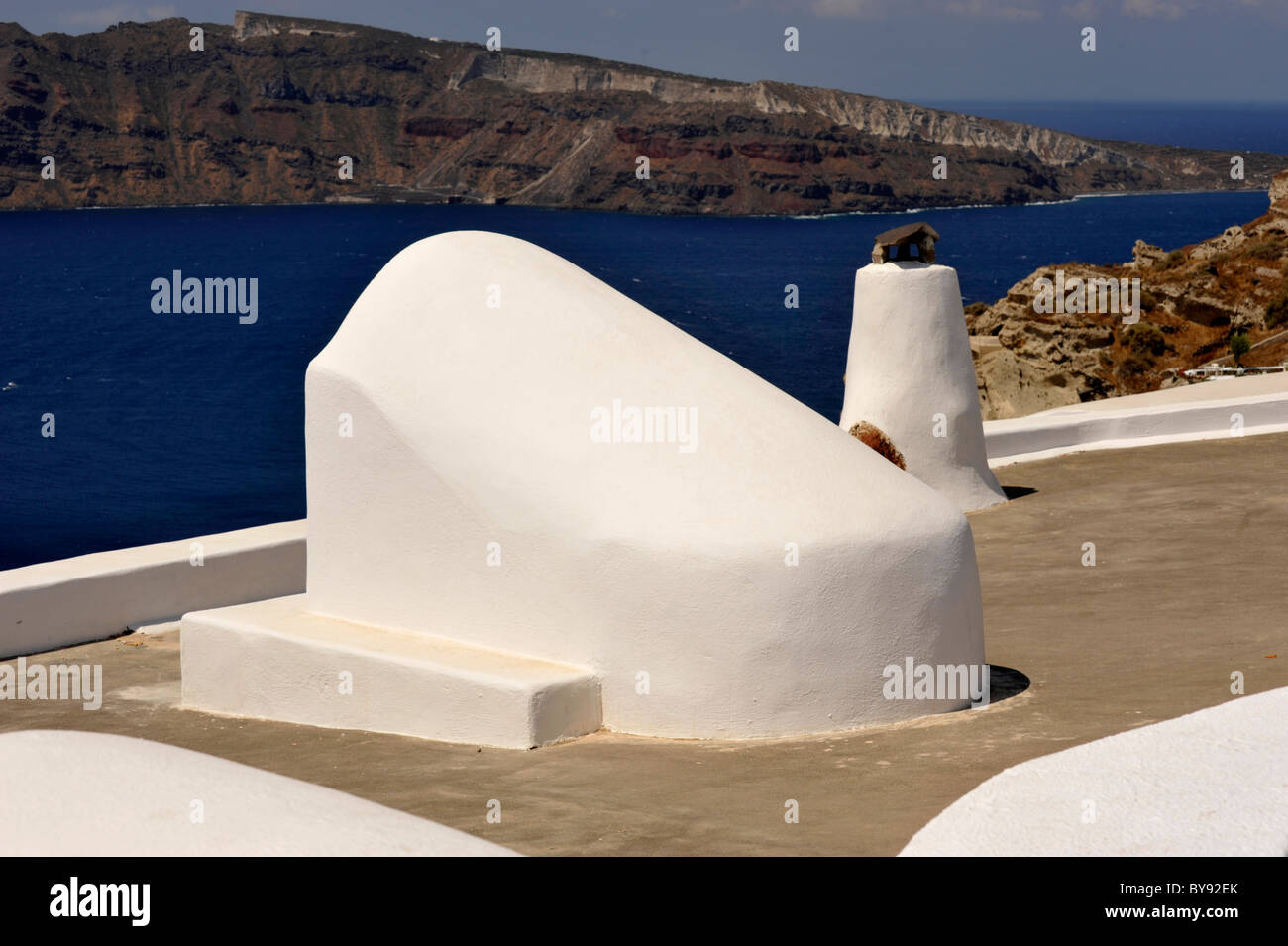 Unusual chimney pots and rooftops on the Greek island of Santorini in ...