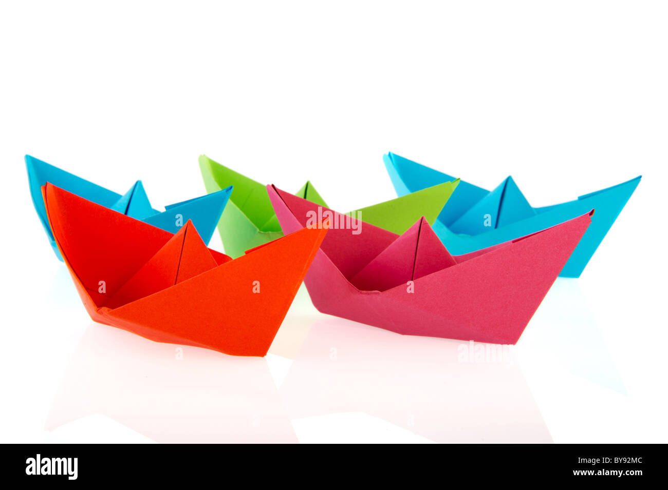 Colorful folded paper boats isolated over white background Stock Photo ...