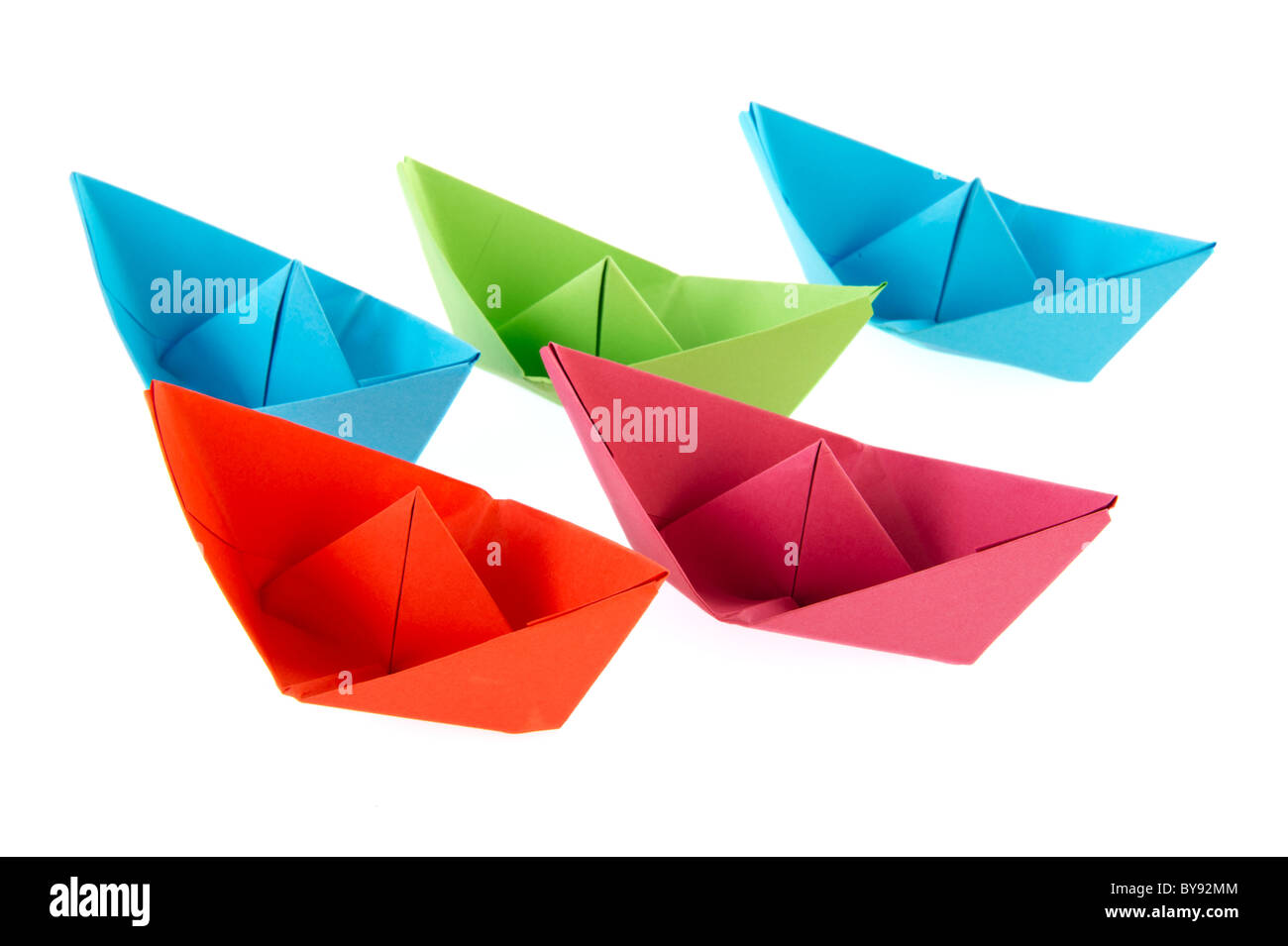 Colorful folded paper boats isolated over white background Stock Photo ...