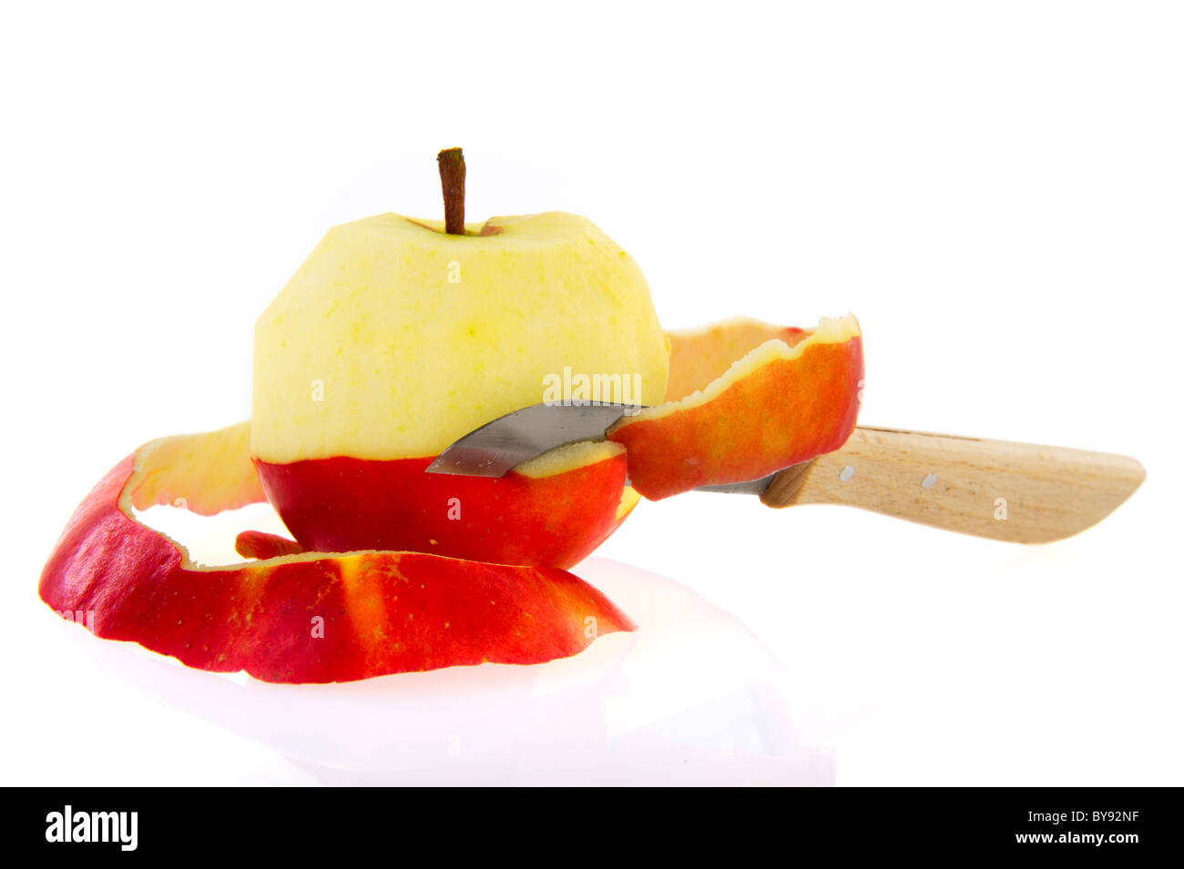 peeling an apple with a knife isolated over white background Stock ...