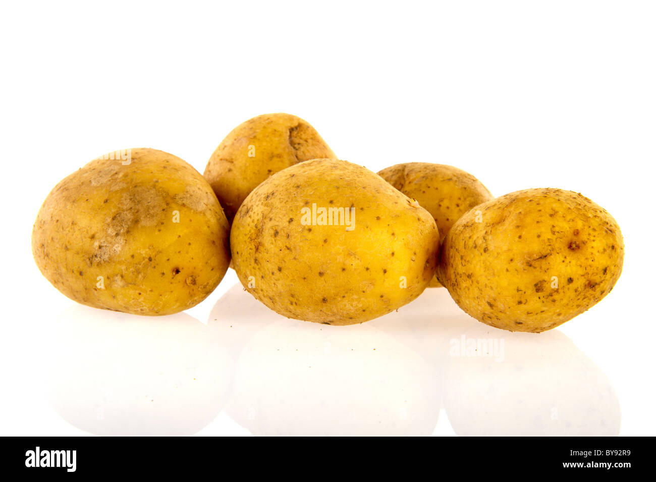 Several fresh potatoes isolated on white background Stock Photo - Alamy