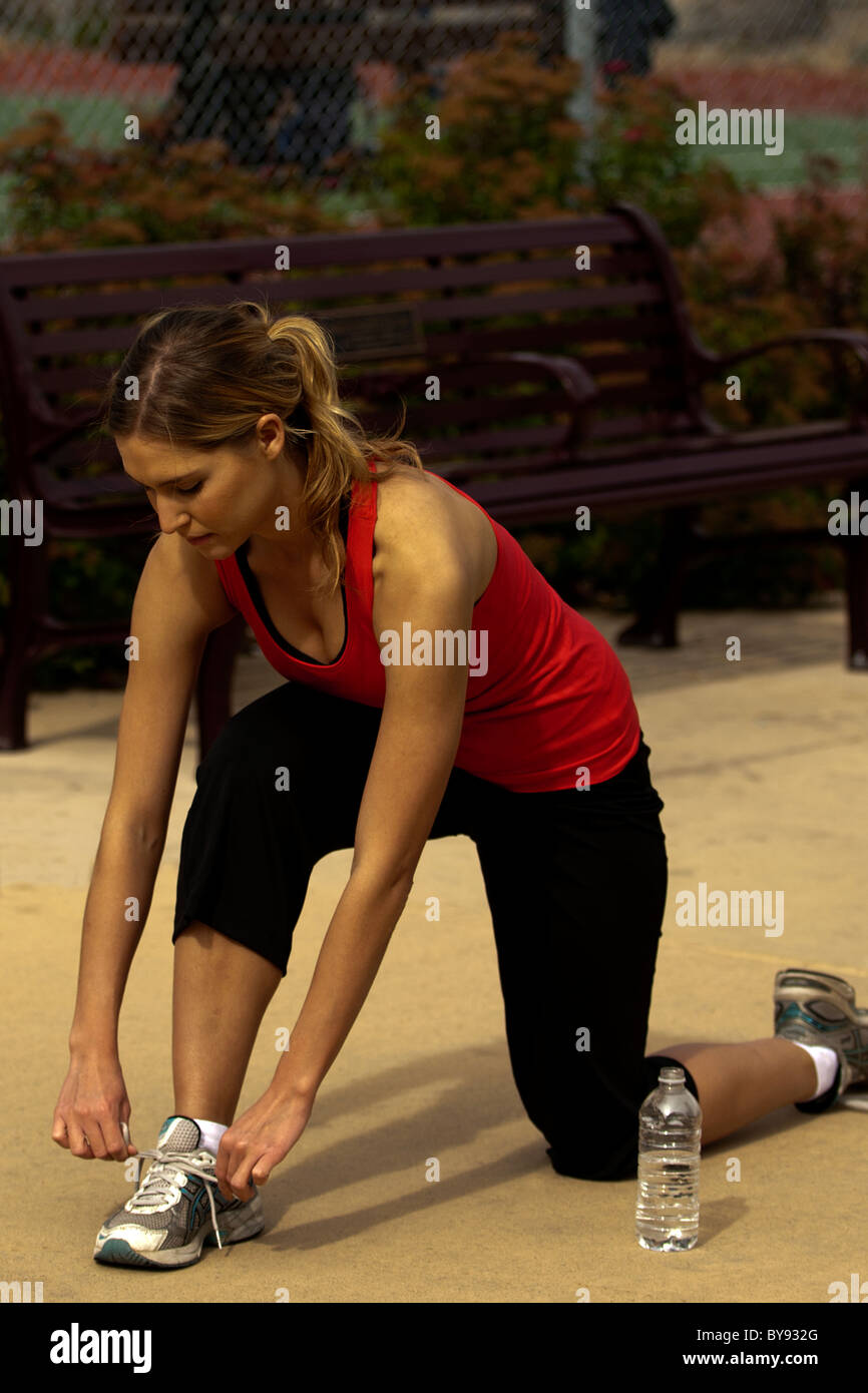 Outdoor spring training exercise in city park showing beautiful young ...