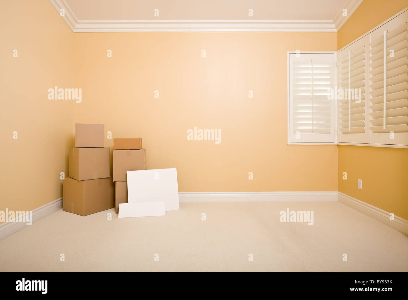 Moving Boxes and Blank Signs on Floor in Empty Room with Copy Space on ...