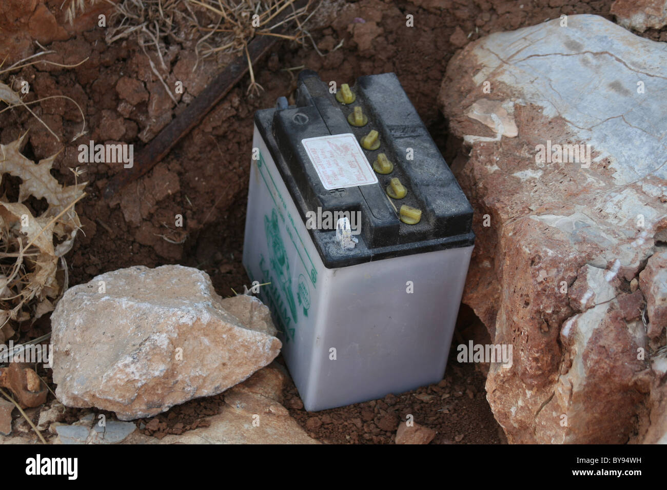 car battery among rocks Stock Photo - Alamy