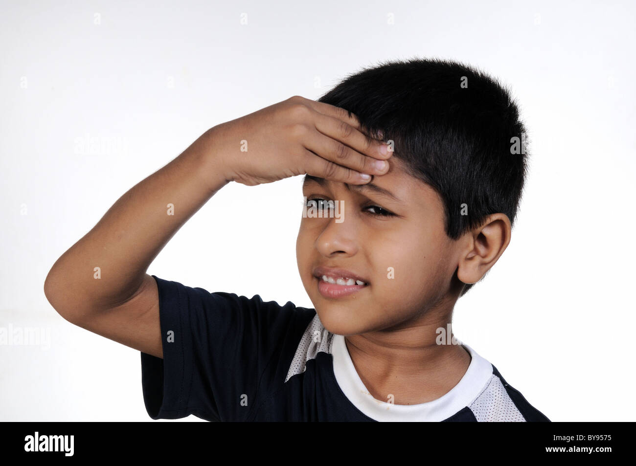 an handsome young indian kid thinking about something Stock Photo - Alamy