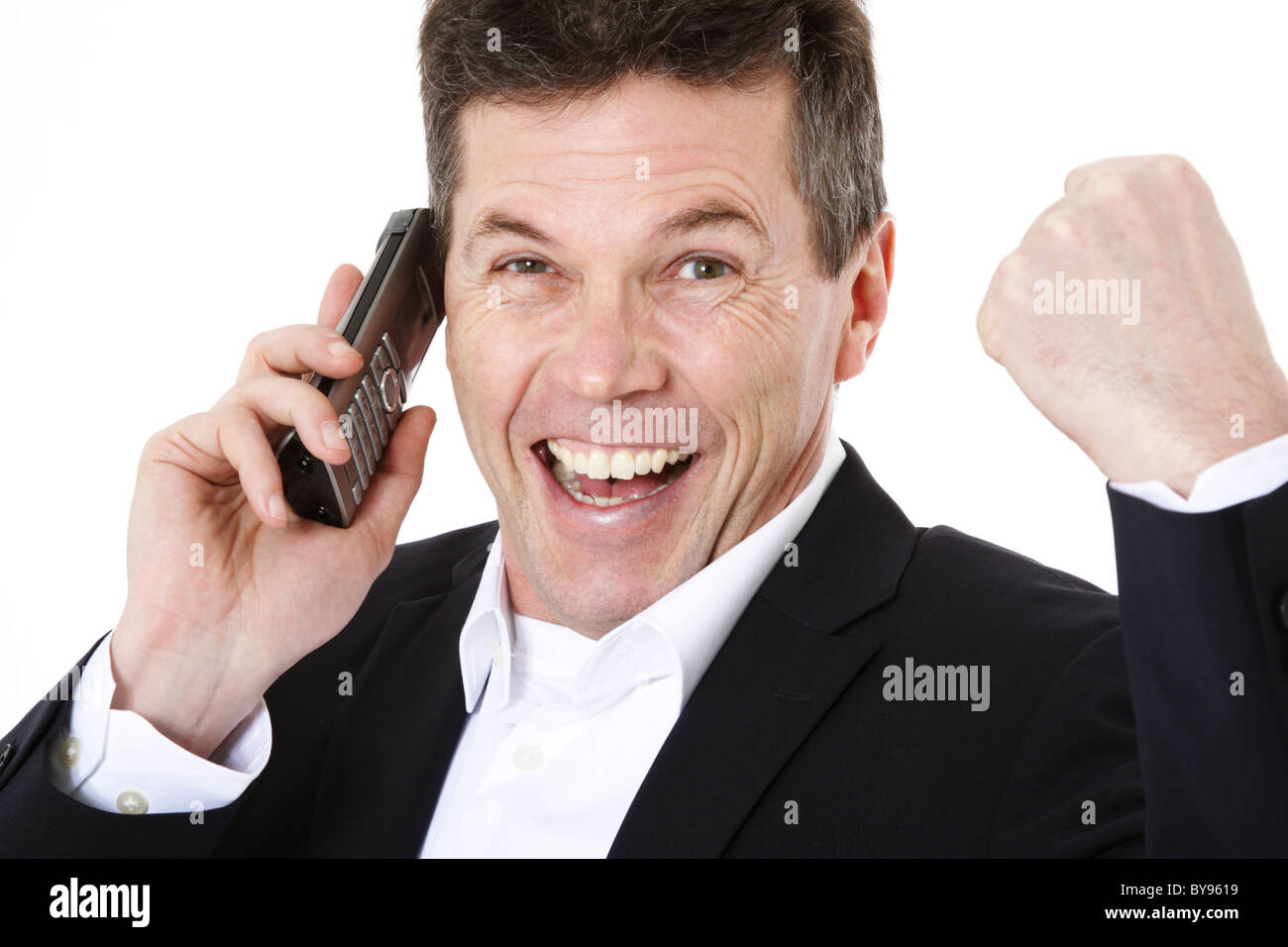 Cheering middle-aged man making a phone call. All on white background ...