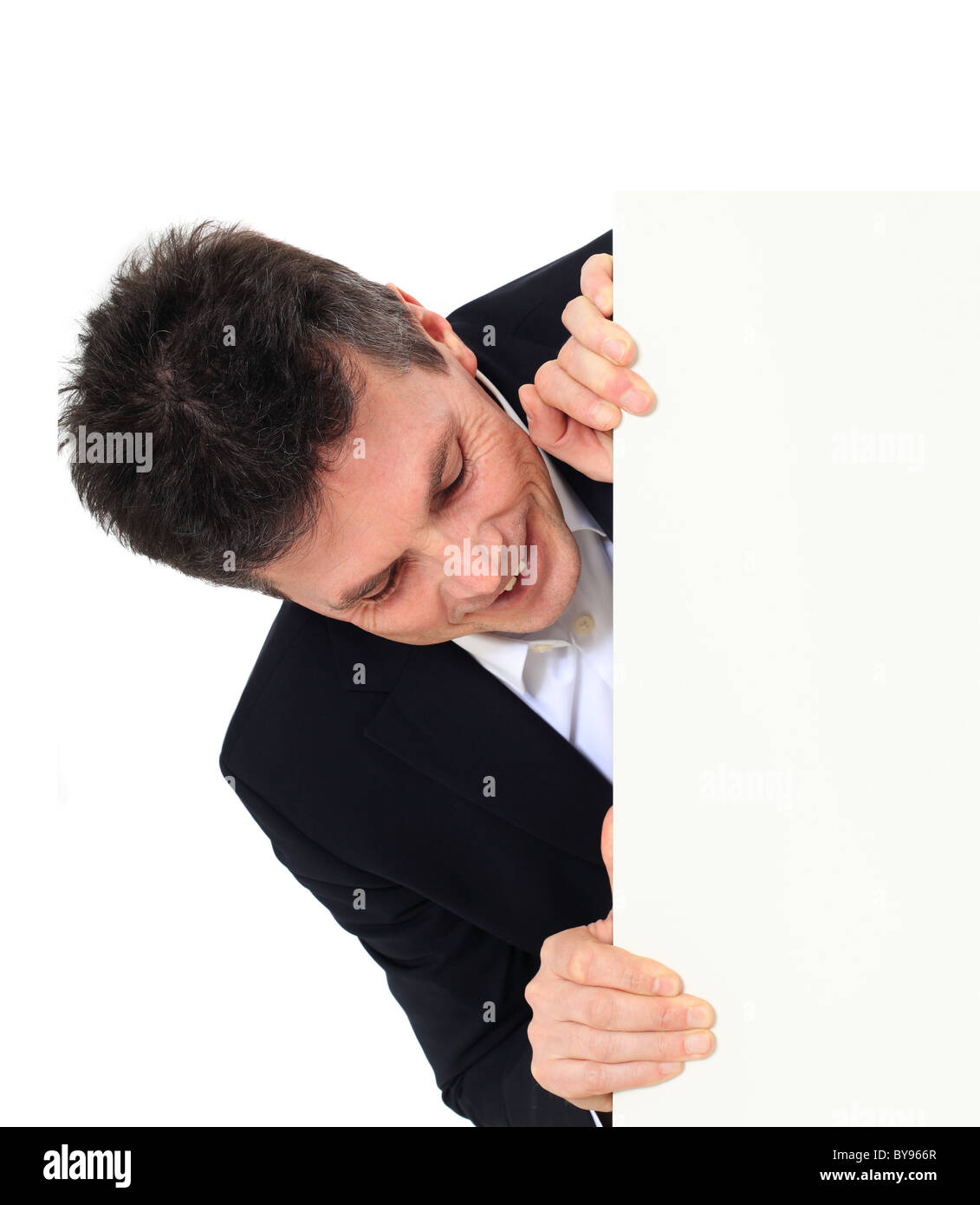 Attractive middle-aged man standing behind a white board. All on white ...